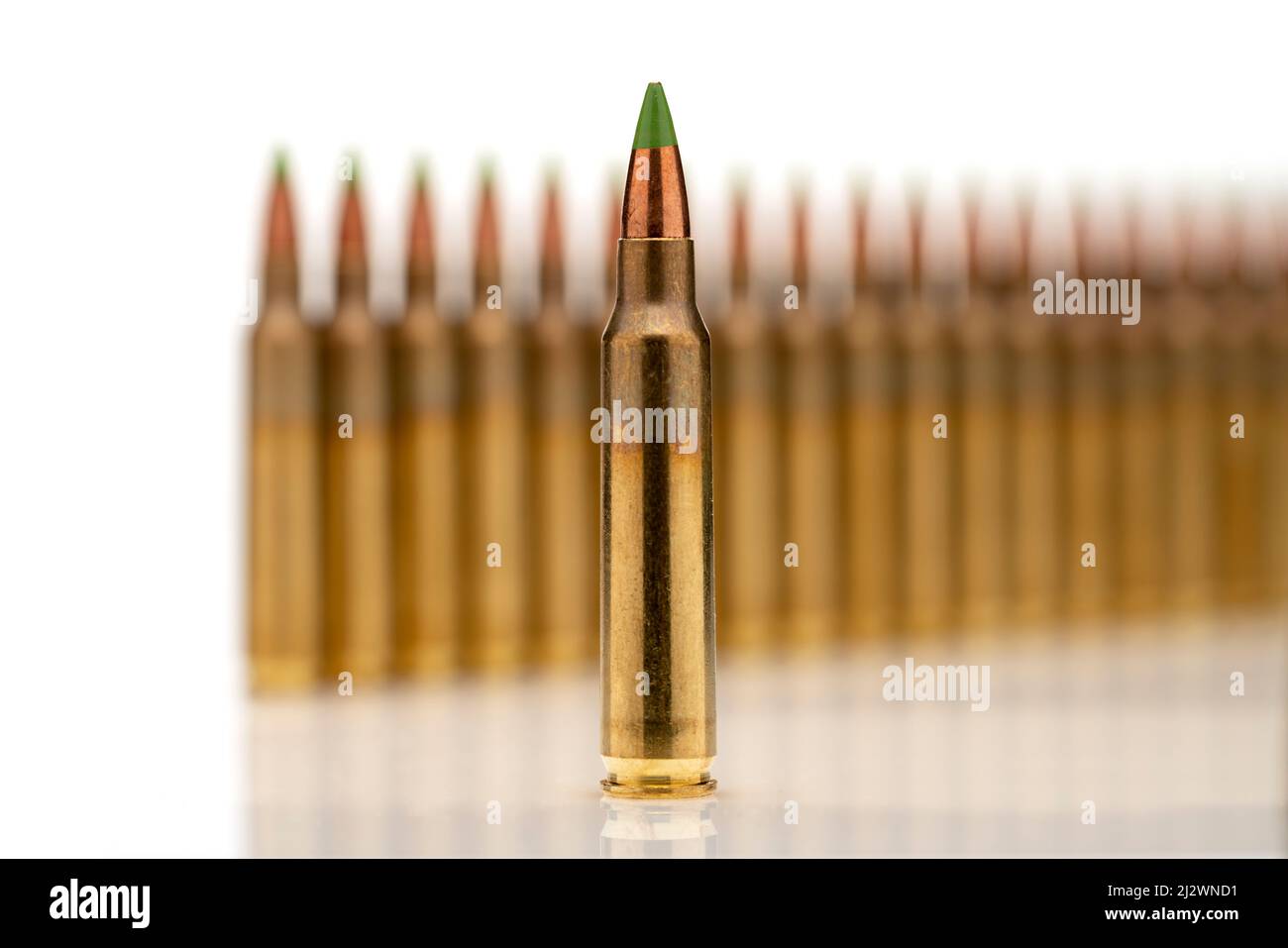 A group of 5.56 calibar, green tip bullets on white background Stock ...