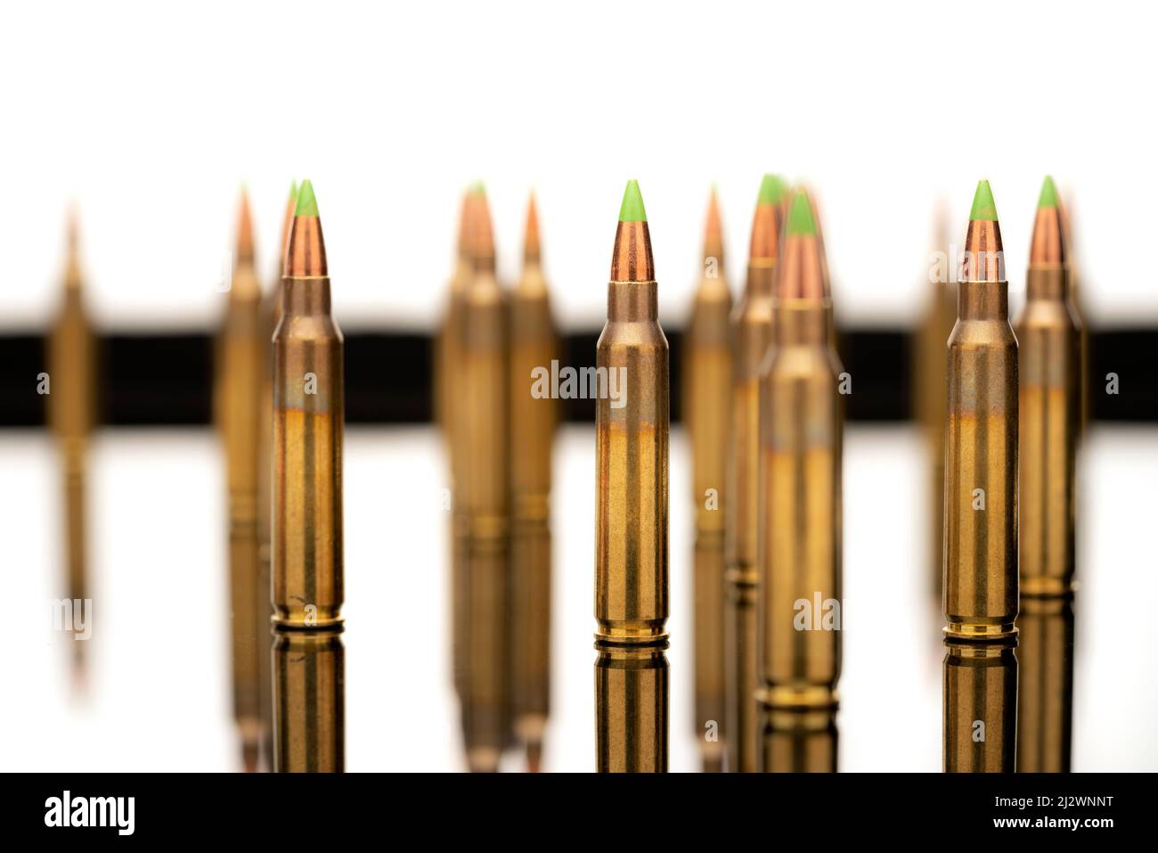 A group of 5.56 calibar, green tip bullets on white background Stock ...