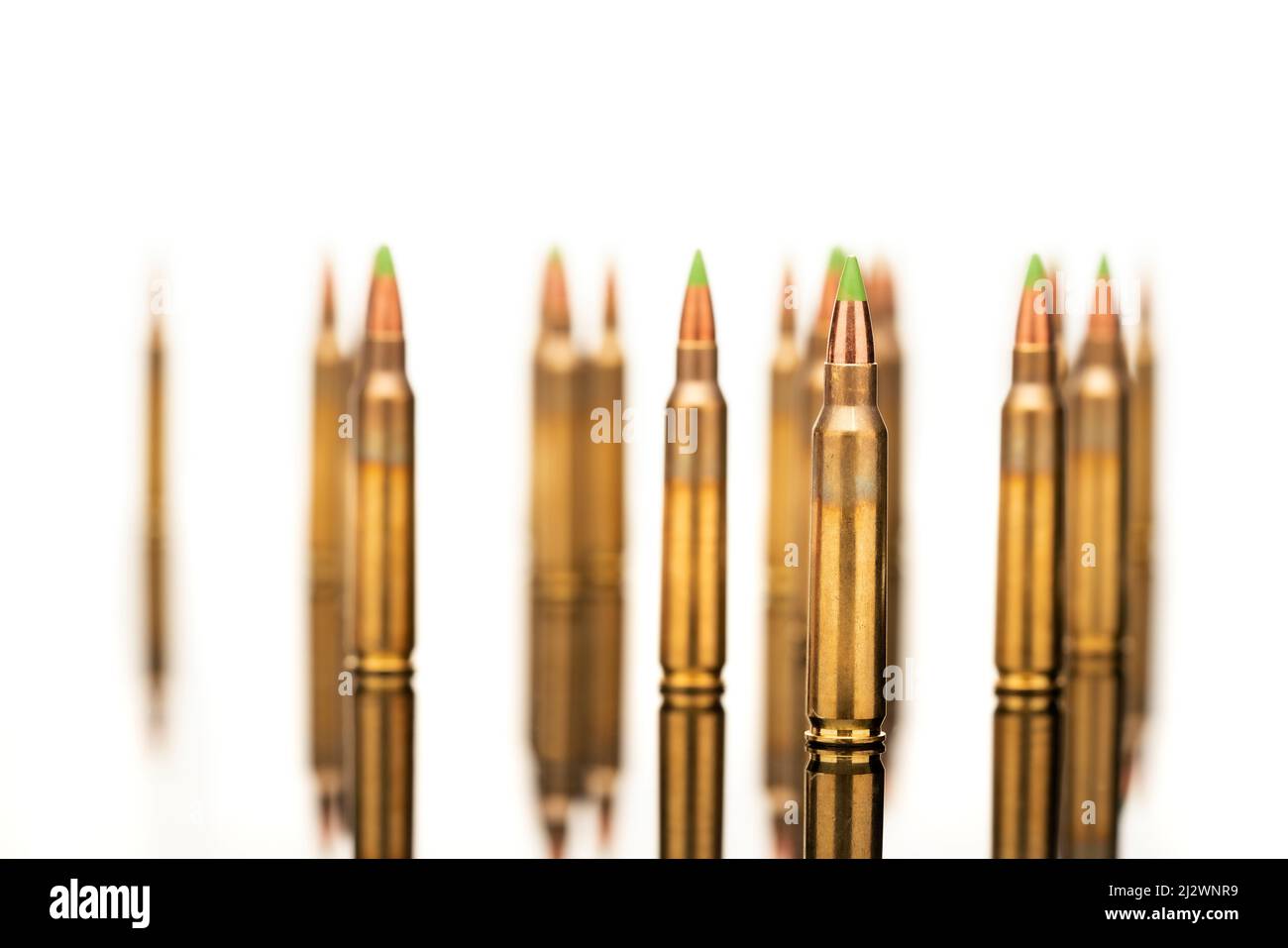 A group of 5.56 calibar, green tip bullets on white background Stock ...