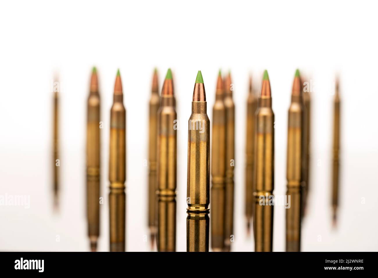 A group of 5.56 calibar, green tip bullets on white background Stock ...