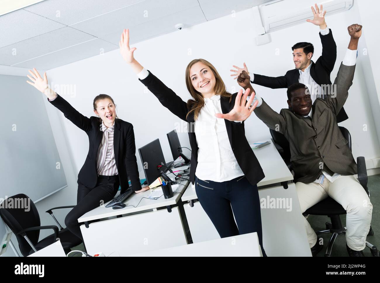 workgroup expressing satisfaction with teamwork Stock Photo - Alamy