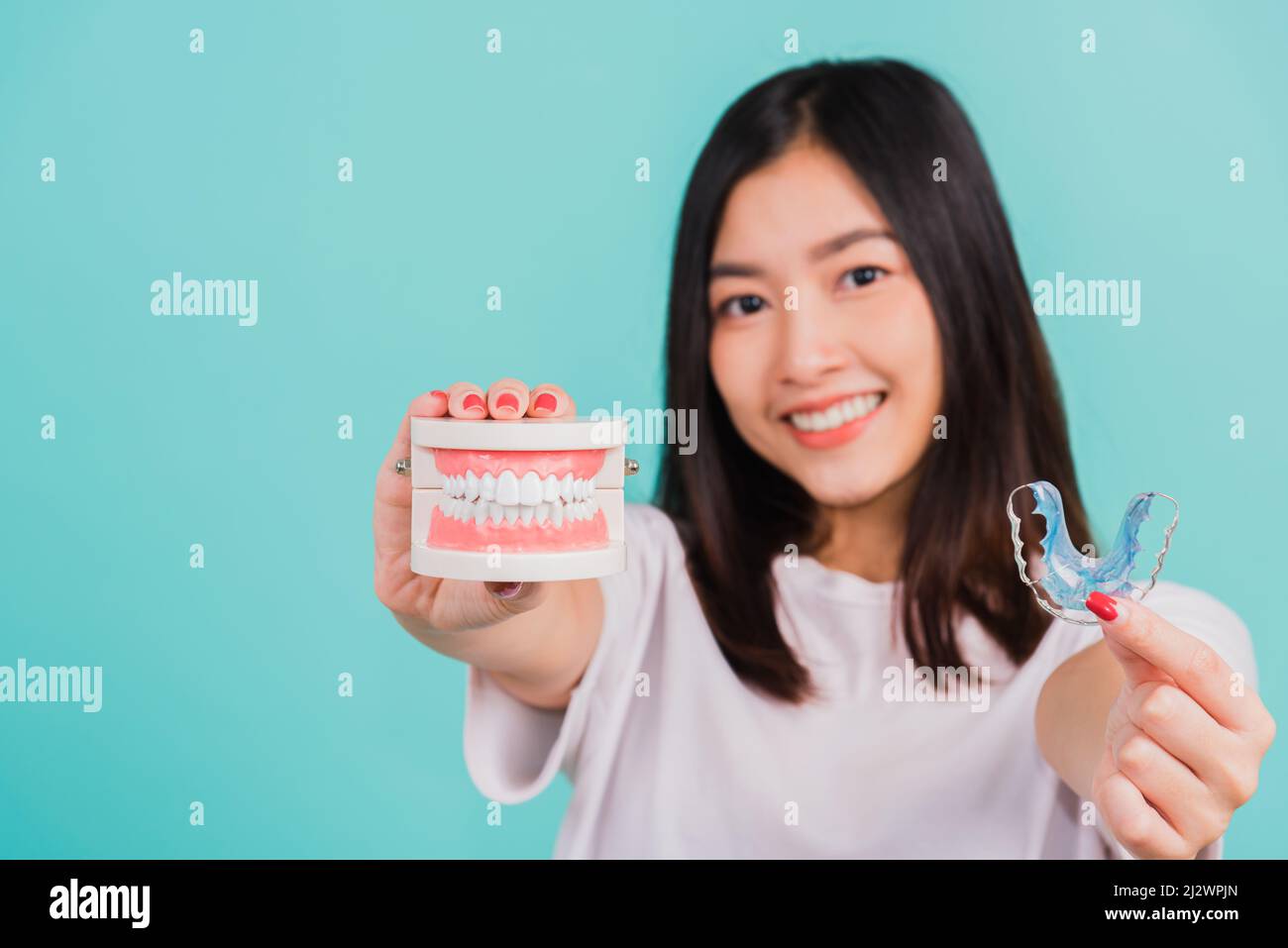 Portrait young Asian beautiful woman smiling holding silicone ...