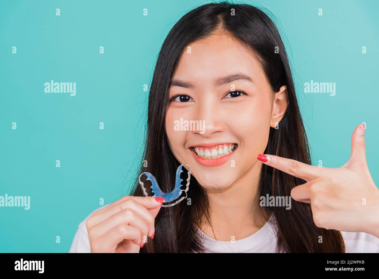 Female hold teeth retaining tools after removable braces, Portrait ...
