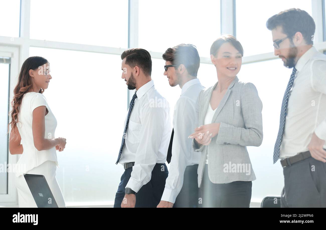 business team looks out the office window Stock Photo - Alamy