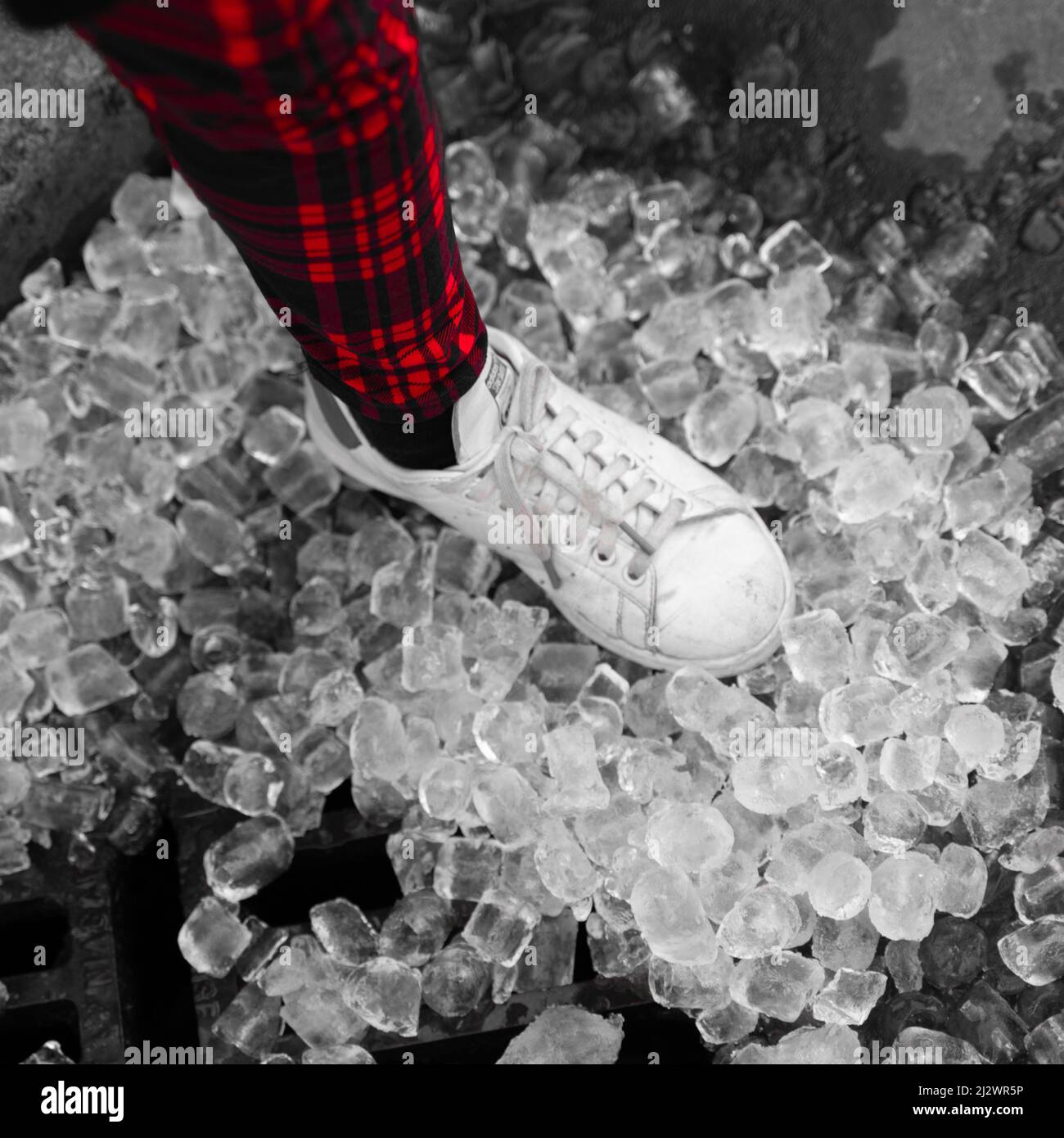 Foot crushing ice Stock Photo - Alamy