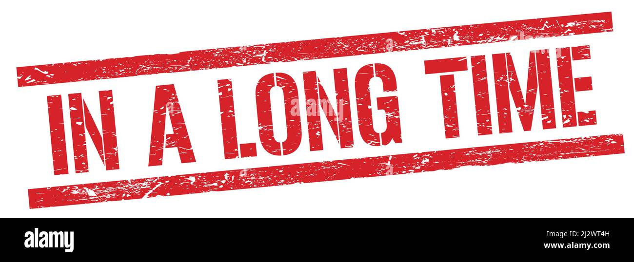 IN A LONG TIME text on red grungy rectangle stamp sign Stock Photo - Alamy