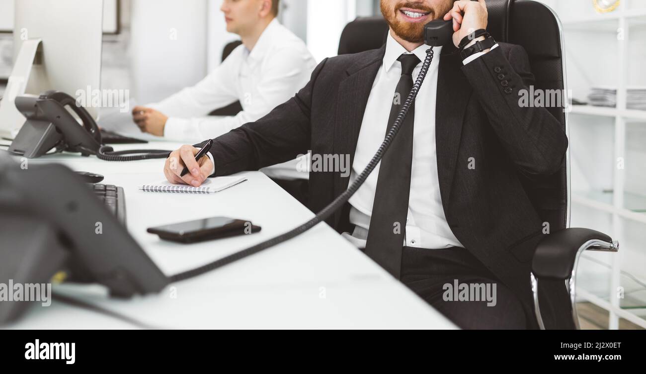 Employees of the company at work in the office. Workplace and everyday ...