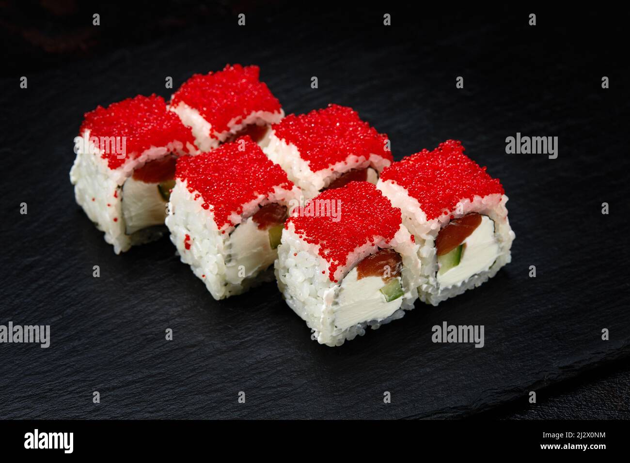 Sushi. Philadelphia roll with fresh salmon, cucumber, avocado, cream ...