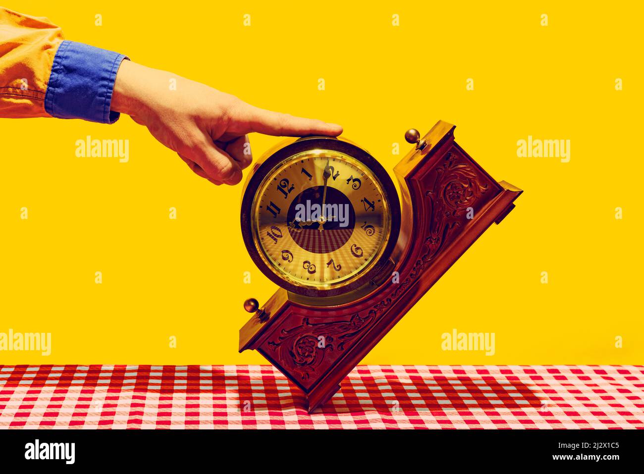 Retro things, pop art photography. Female hand touching vintage clock ...