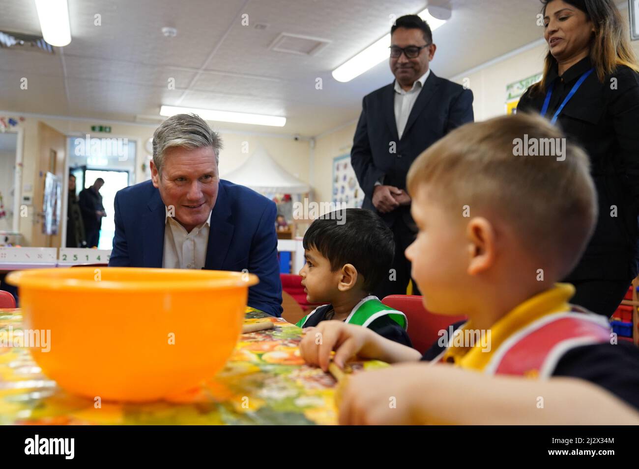 Labour leader Keir Starmer talking with children during a visit to ...
