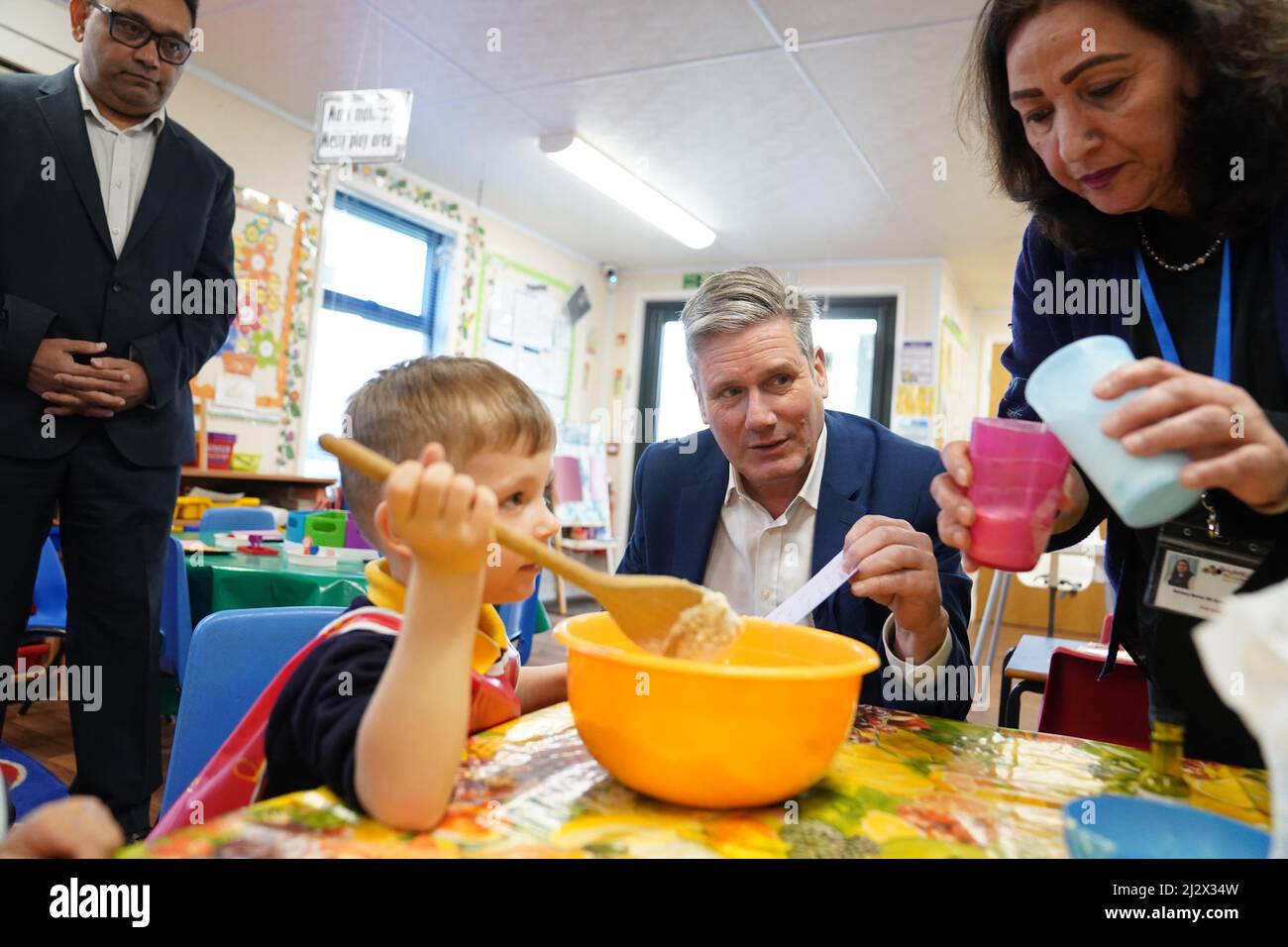 Labour leader Keir Starmer talking with children during a visit to ...