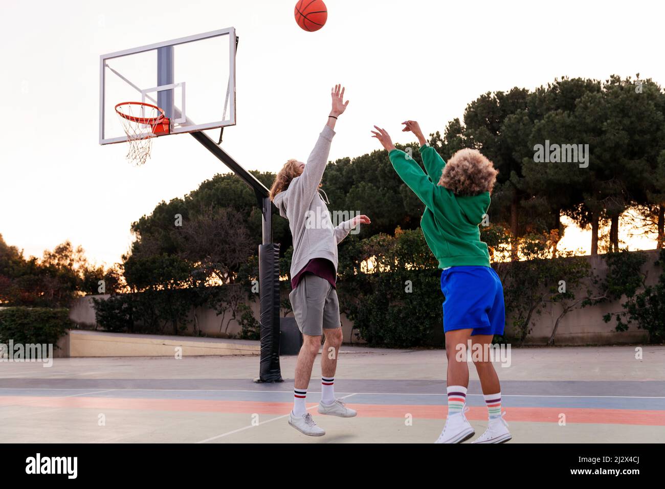 Friends on a basketball court hi-res stock photography and images - Alamy