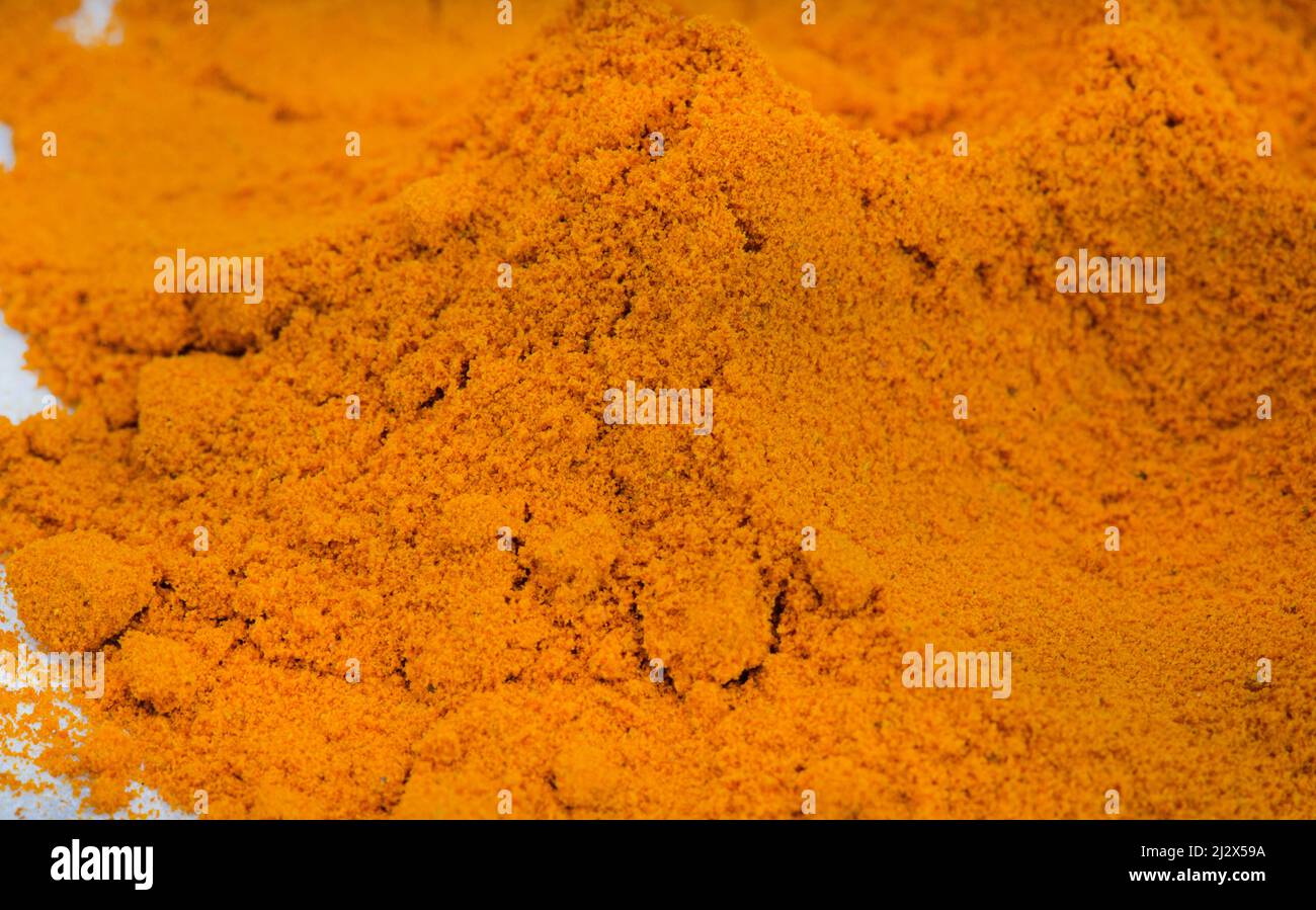 ground Turmeric powder heap with selective focus, full frame Stock ...