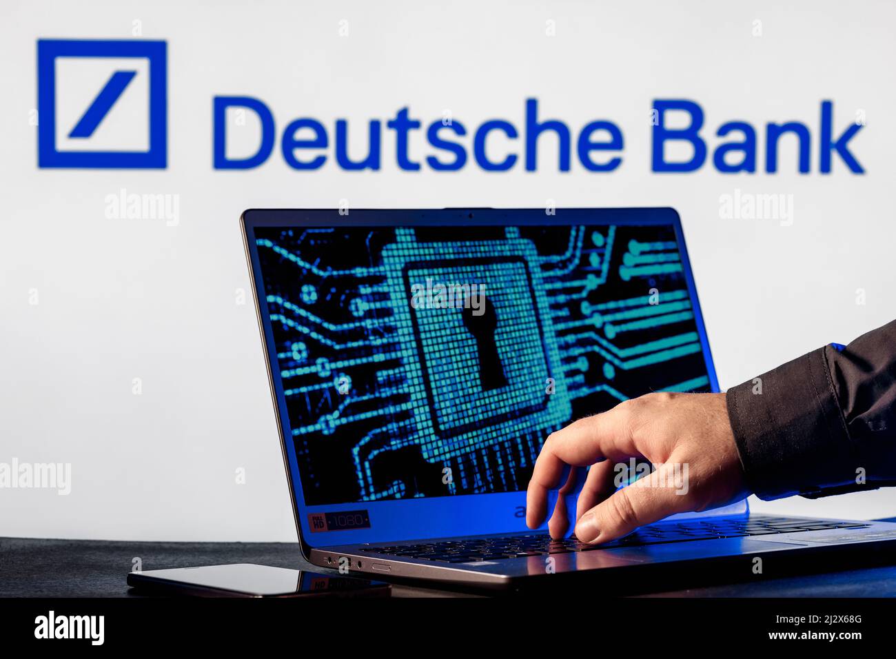 Laptop with lock symbol on screen on background of Deutsche bank logo ...
