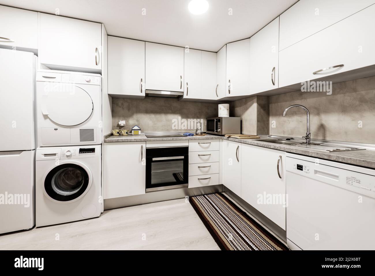 Large kitchen with appliances, column washer and dryer, gray ...
