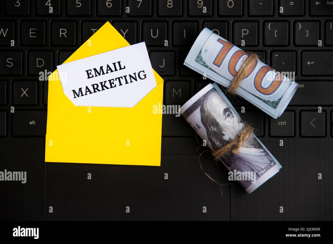 Top view of email marketing text on notepad in an envelope with bank ...
