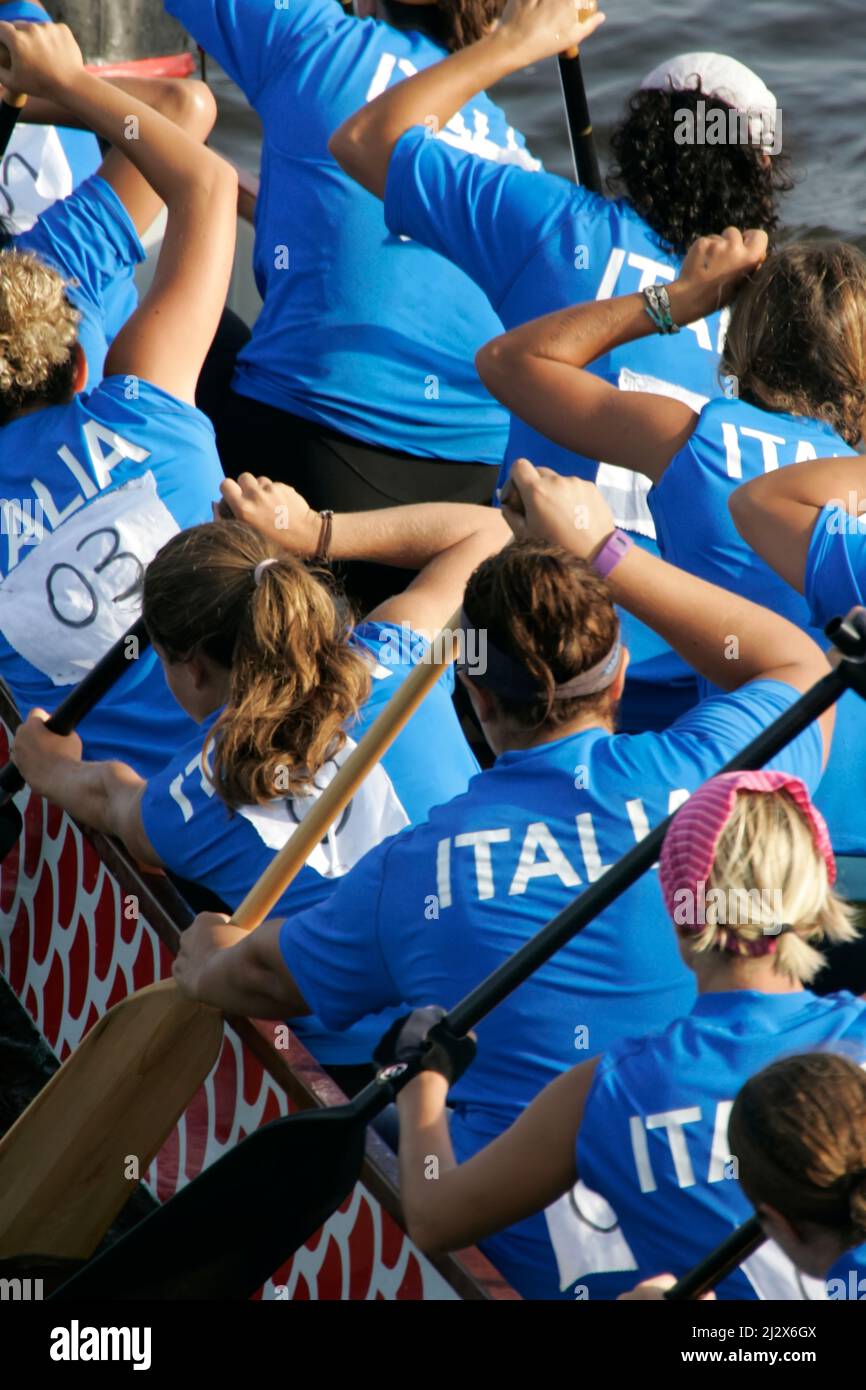 crew with paddles in a dragon boat Stock Photo - Alamy