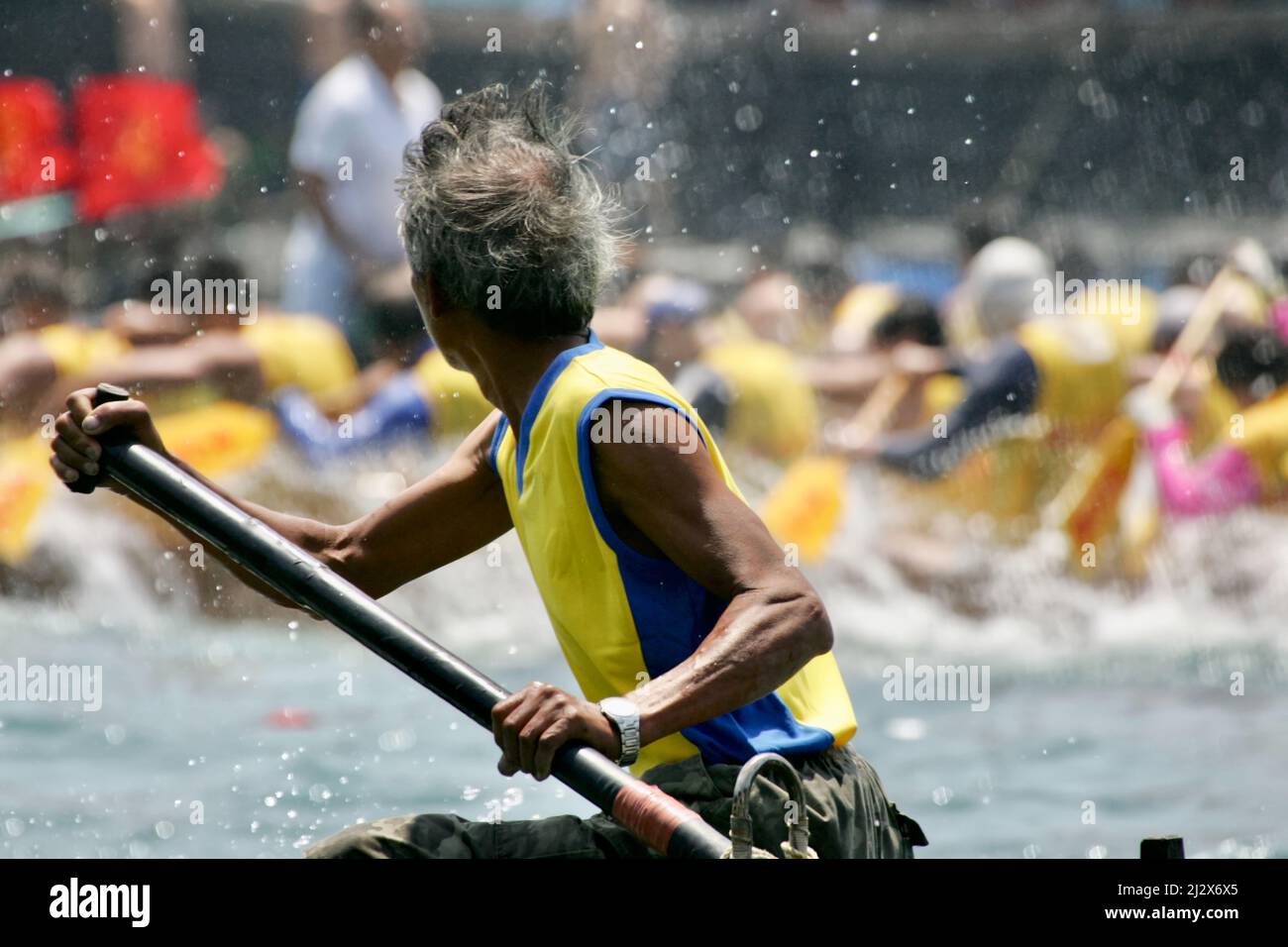 man steering a dragon boat Stock Photo - Alamy