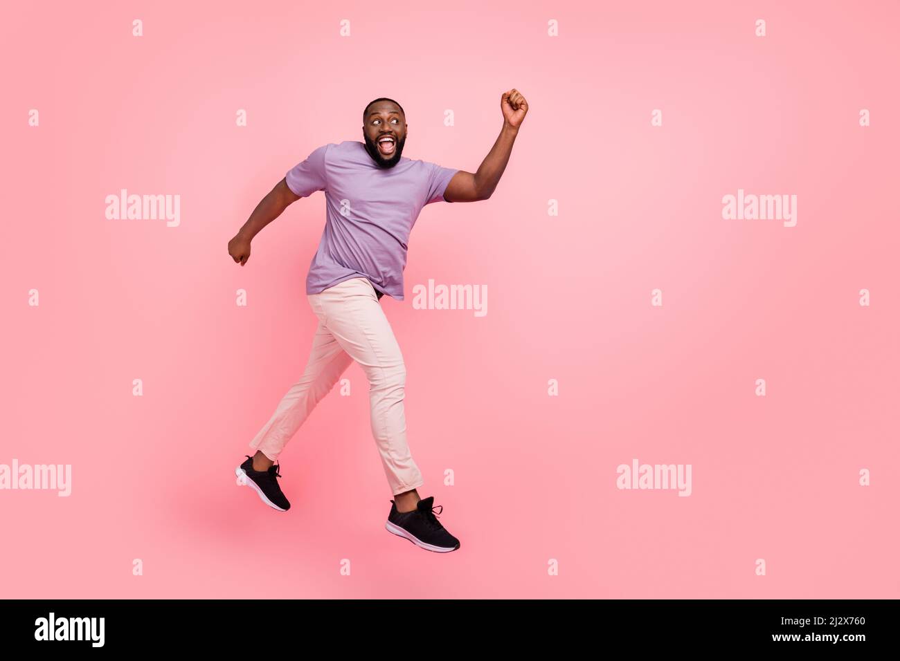 Full length body size view of attractive cheerful active guy jumping ...