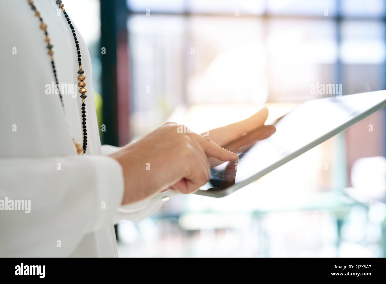 Reach out to success. Cropped shot of a businesswoman using a digital ...