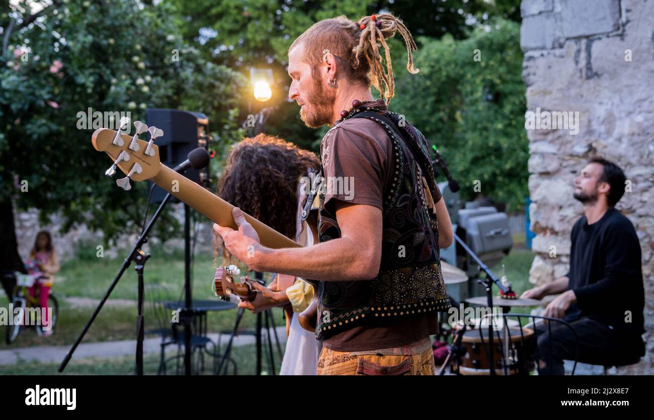 Young guitarist playing guitar in a live performance Stock Photo - Alamy