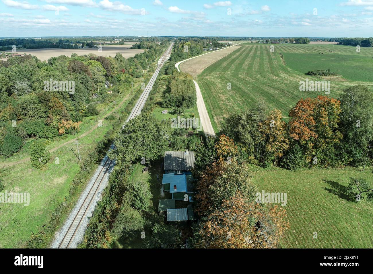 The beautiful countryside landscape with a rustic house surrounded by ...