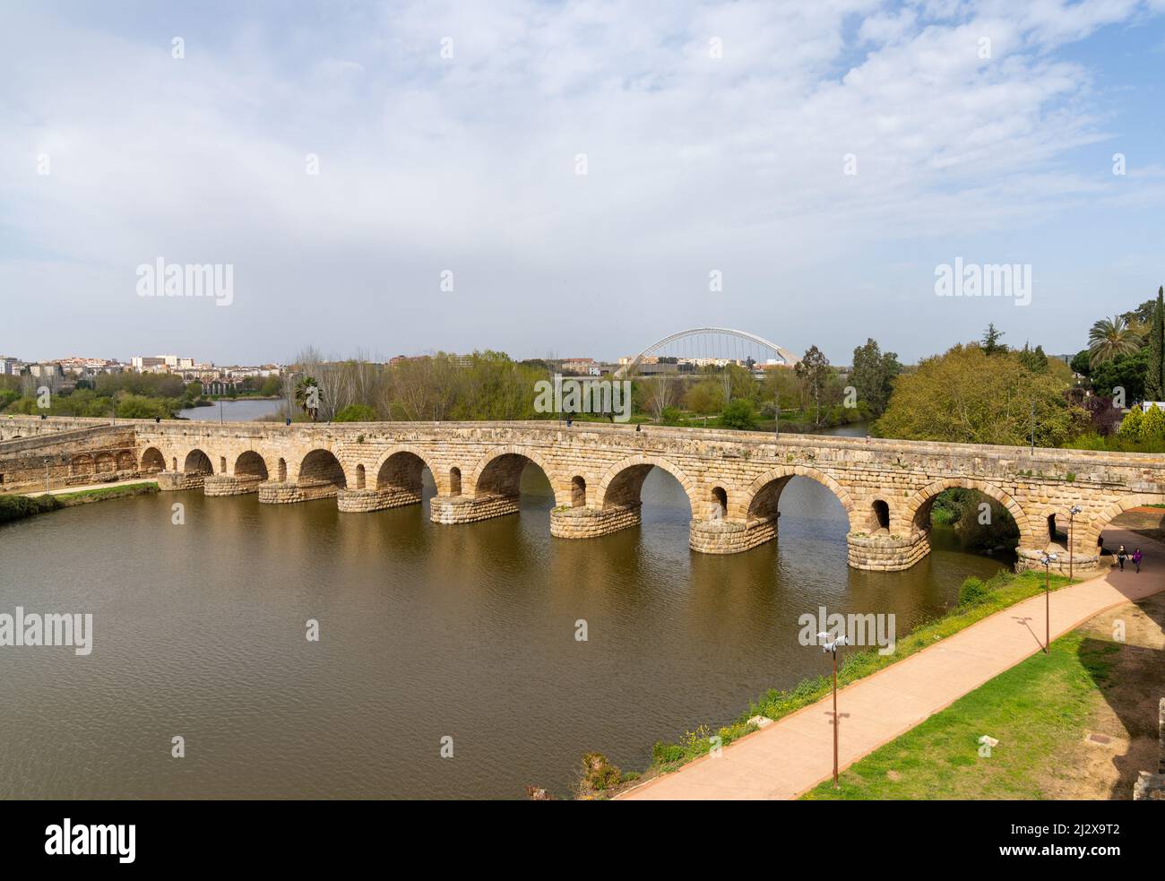 Merida, Spain -- 28 March, 2022: the ancient Roman bridge over the ...