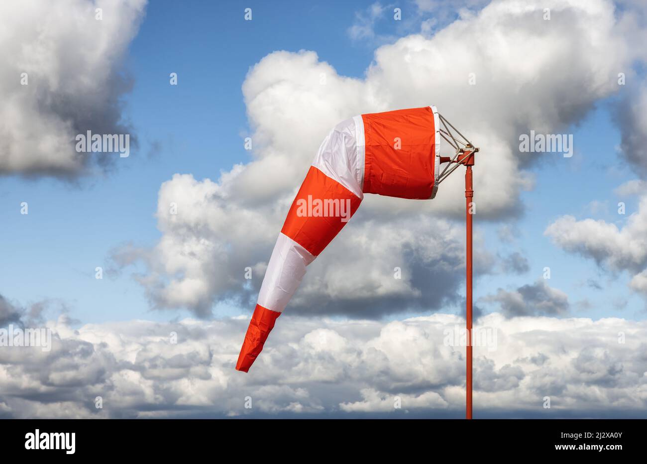 Windsock at an airport with a cloudy sunny sky in background Stock ...