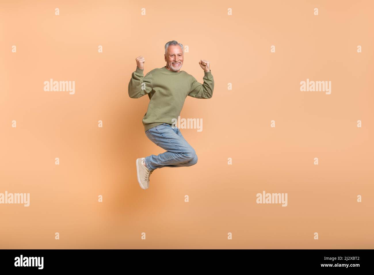 Full body photo of hooray aged grey hairdo man jump wear pullover jeans ...