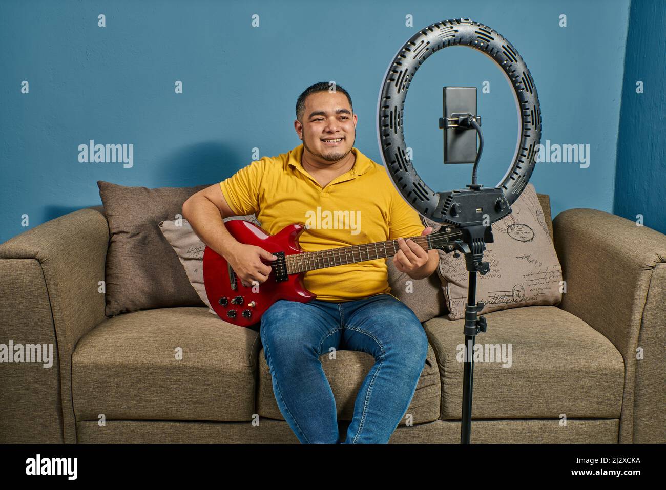 Teaching guitar in online courses with live lessons Stock Photo - Alamy