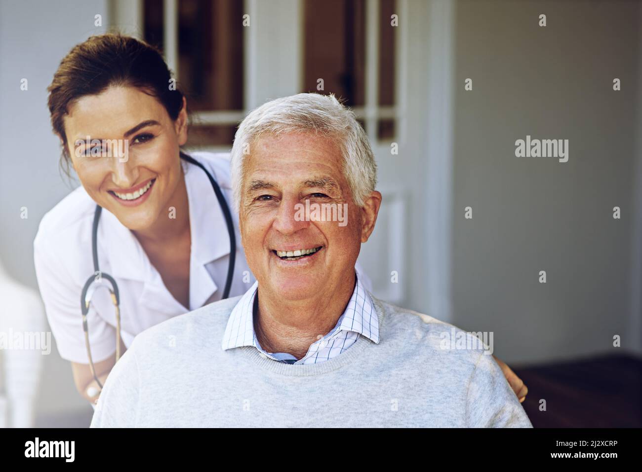Healthcare with a smile. Portrait of a smiling caregiver and a senior ...