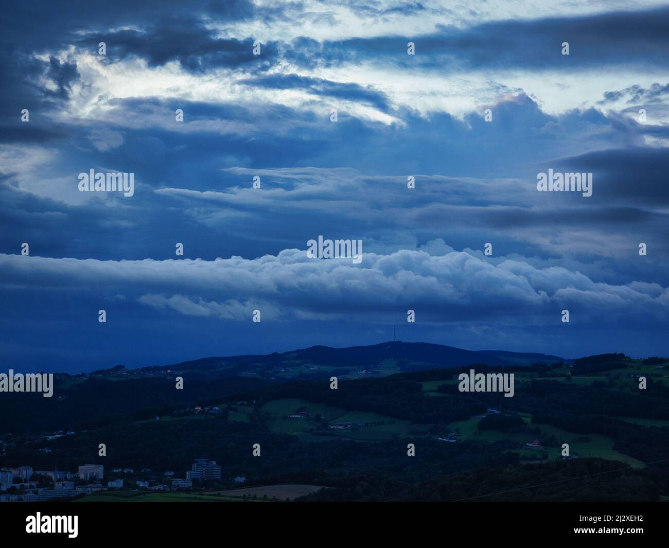 gloomy sky over city, panorama of a city at the Danube with dark sky ...