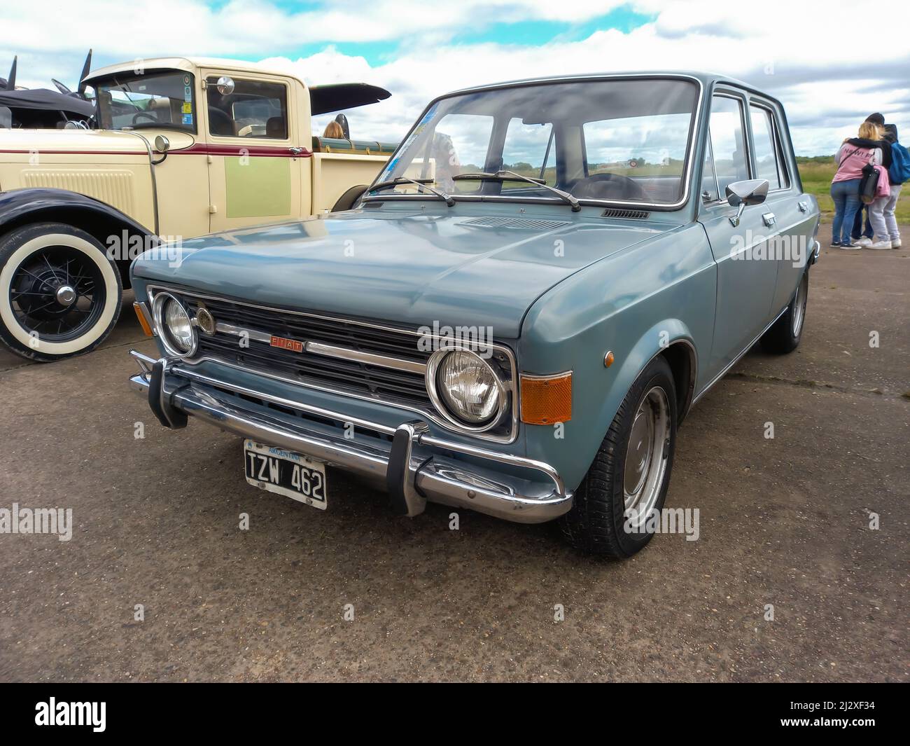 Moron, Argentina - Mar 26, 2022 - old popular cyan Fiat 128 sedan small ...