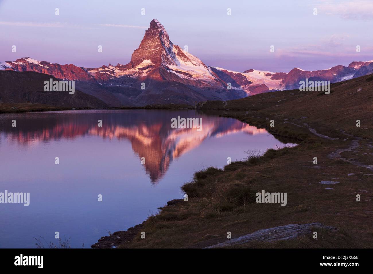 Mount Matterhorn sunrise reflection in lake Stellisee near Zermatt ...