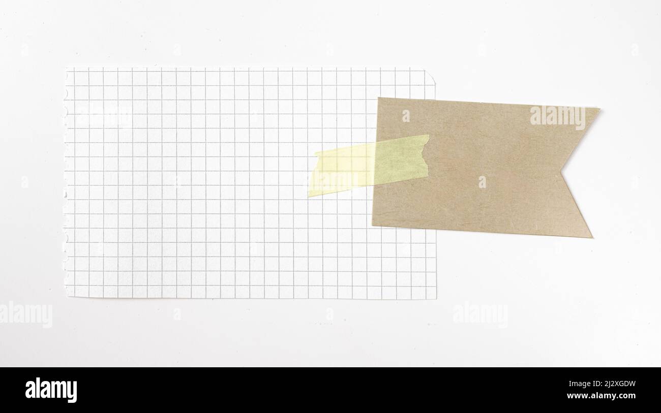 Checked notepad with sticker Stock Photo - Alamy