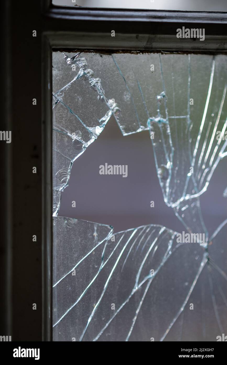 Broken window glass Stock Photo - Alamy