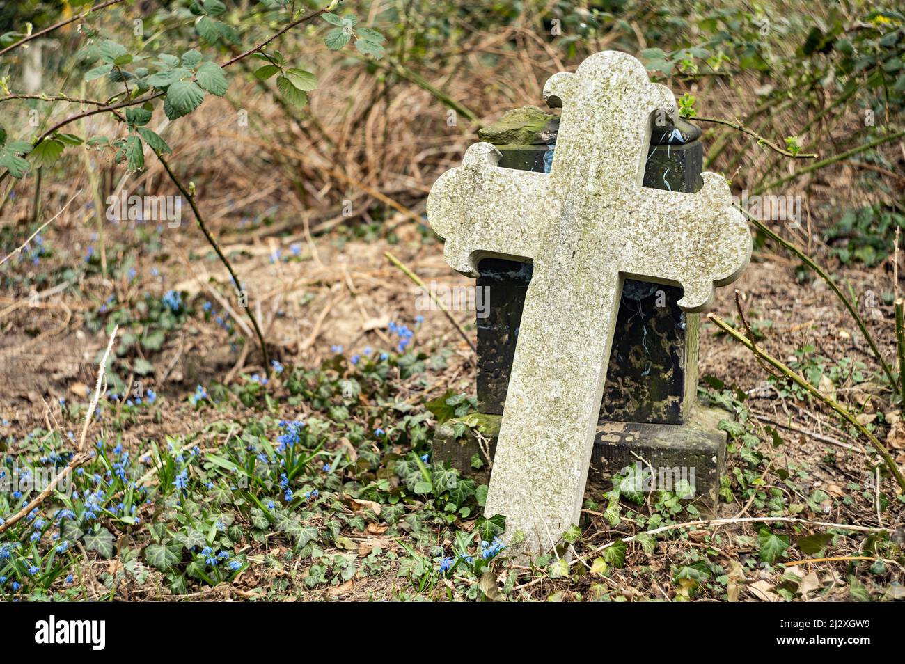 An old cross tombstone on a tomb in cemetery Stock Photo - Alamy