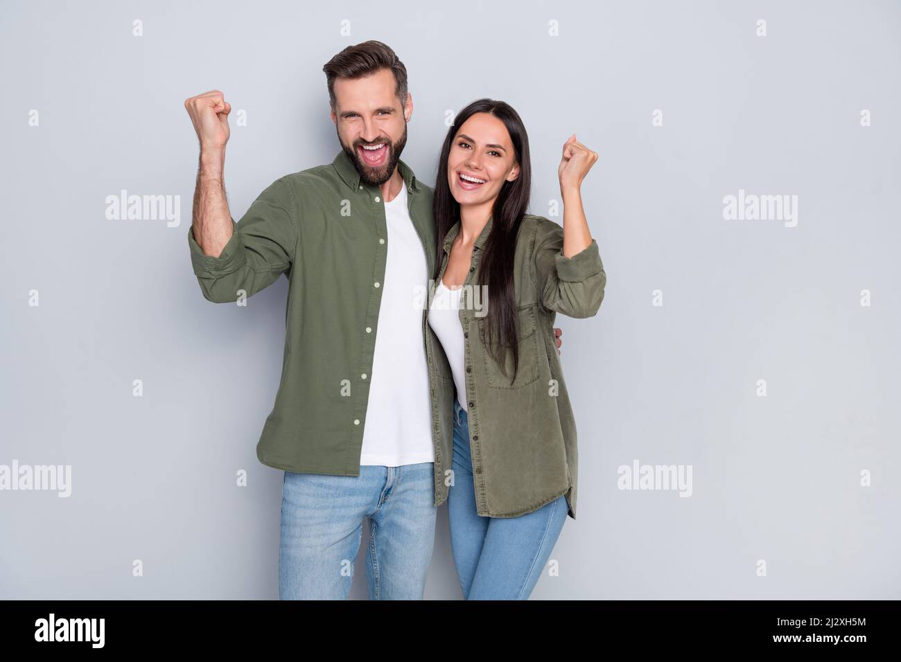 Photo of young two cheerful people celebrate success fists hands ...