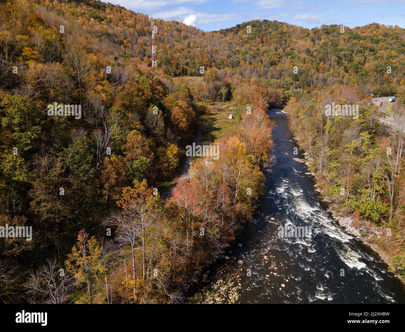 An aerial shot of a beautiful lake flowing in the forest in Tennessee ...