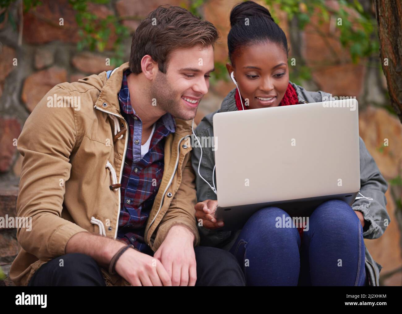 Beautiful young couple helping other hi-res stock photography and ...