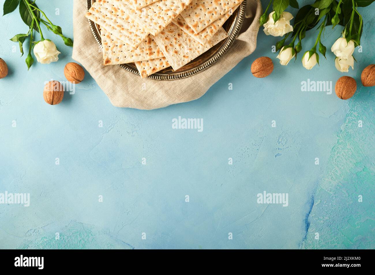 Passover celebration concept. Matzah, red kosher walnut and spring ...