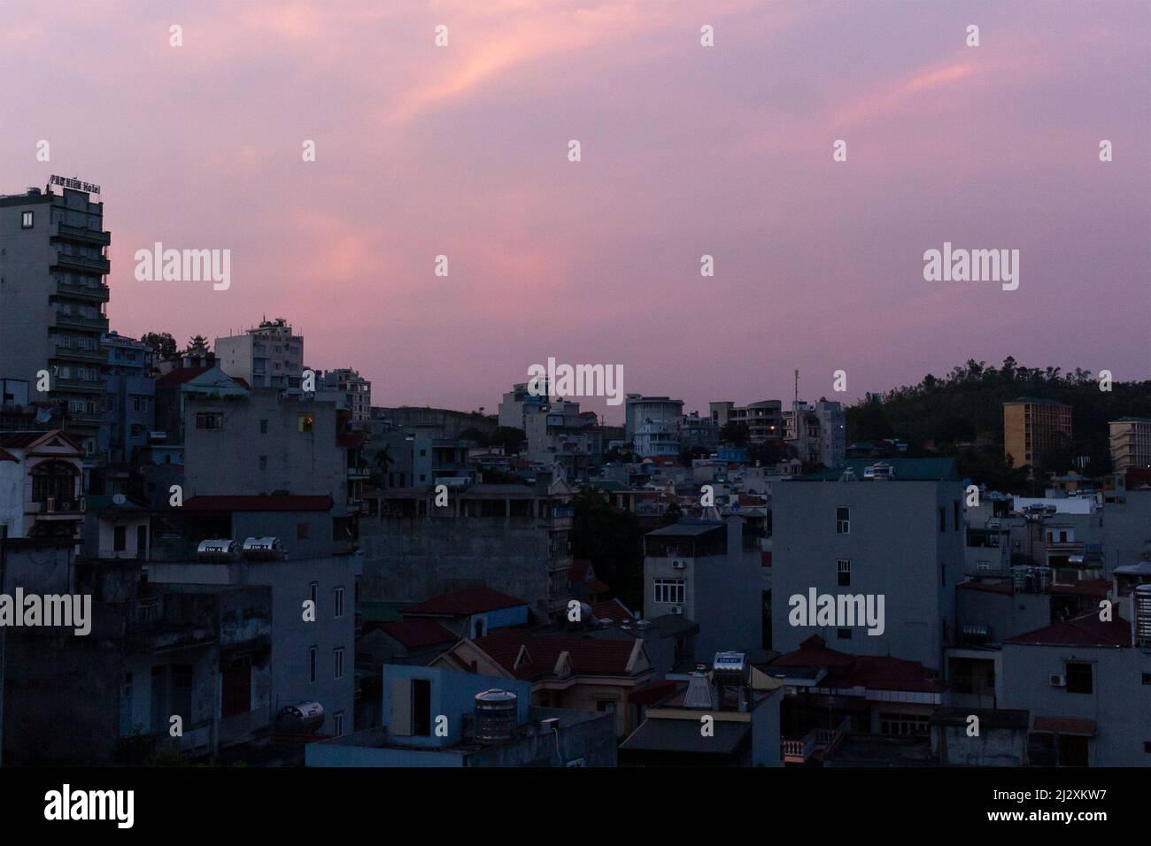 A aerial view of white buildings in Hanoi city in Vietnam with cloudy ...