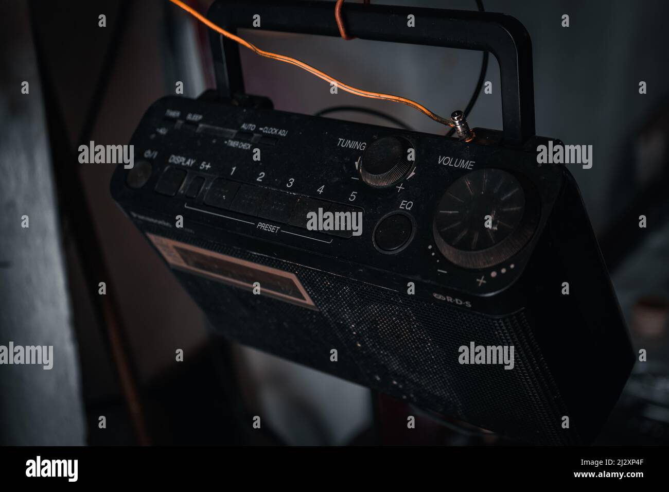 An old radio player hanging from an old Cable Stock Photo - Alamy