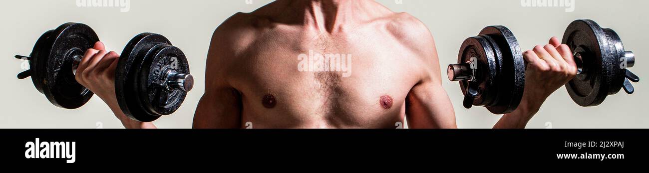 A thin man in sports with dumbbells. Weak man lift a weight, dumbbells ...