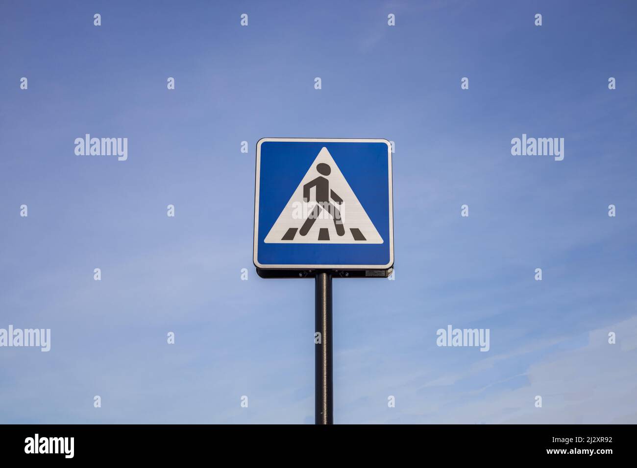 Blue and white pedestrian crossing sign on the sky background Stock ...
