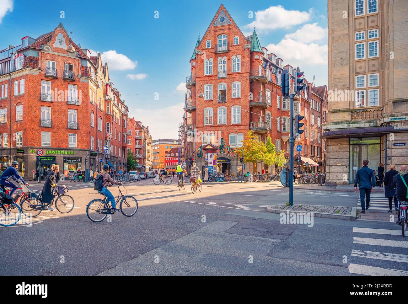 Major street Gothersgade with old brick houses, many cyclists ...
