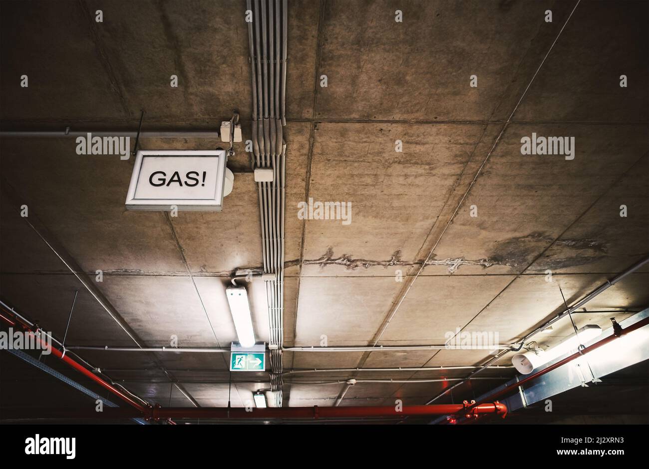 Ceiling infrastructure in the garage with gas sign, details Stock Photo ...