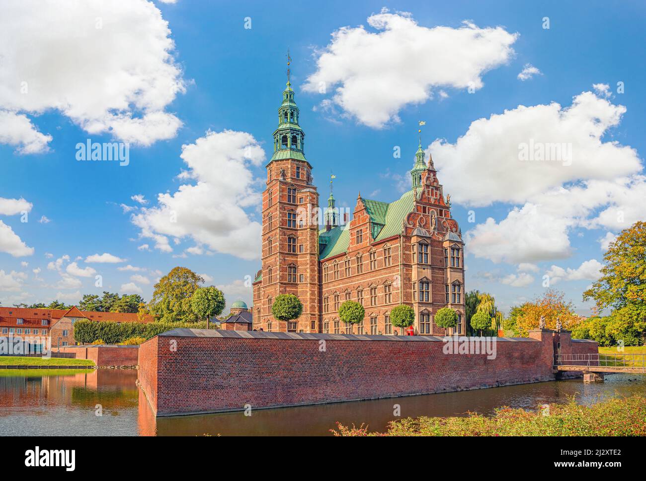 Renaissance castle Rosenborg from red brick with pond in the Kings ...