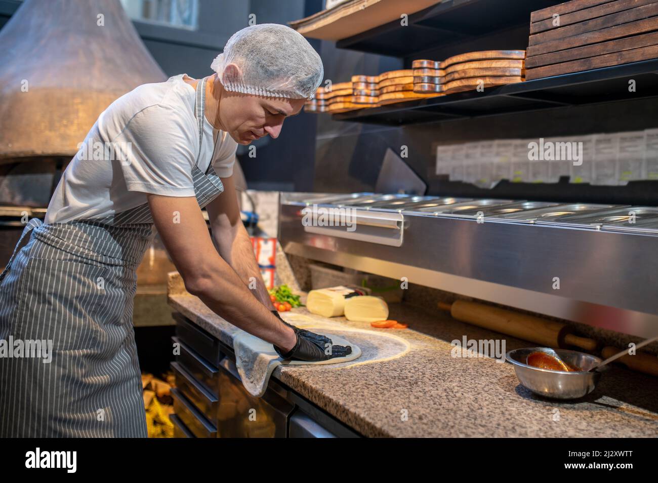 Chef working in the kitchen in the restaurant Stock Photo - Alamy