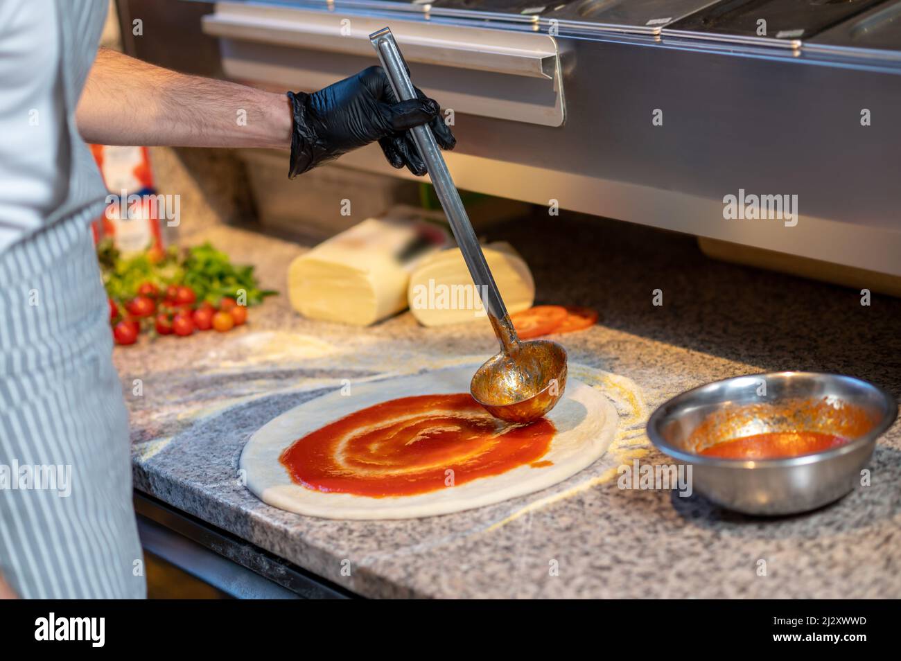 Chef baking pizza in the italian pizzeria Stock Photo - Alamy